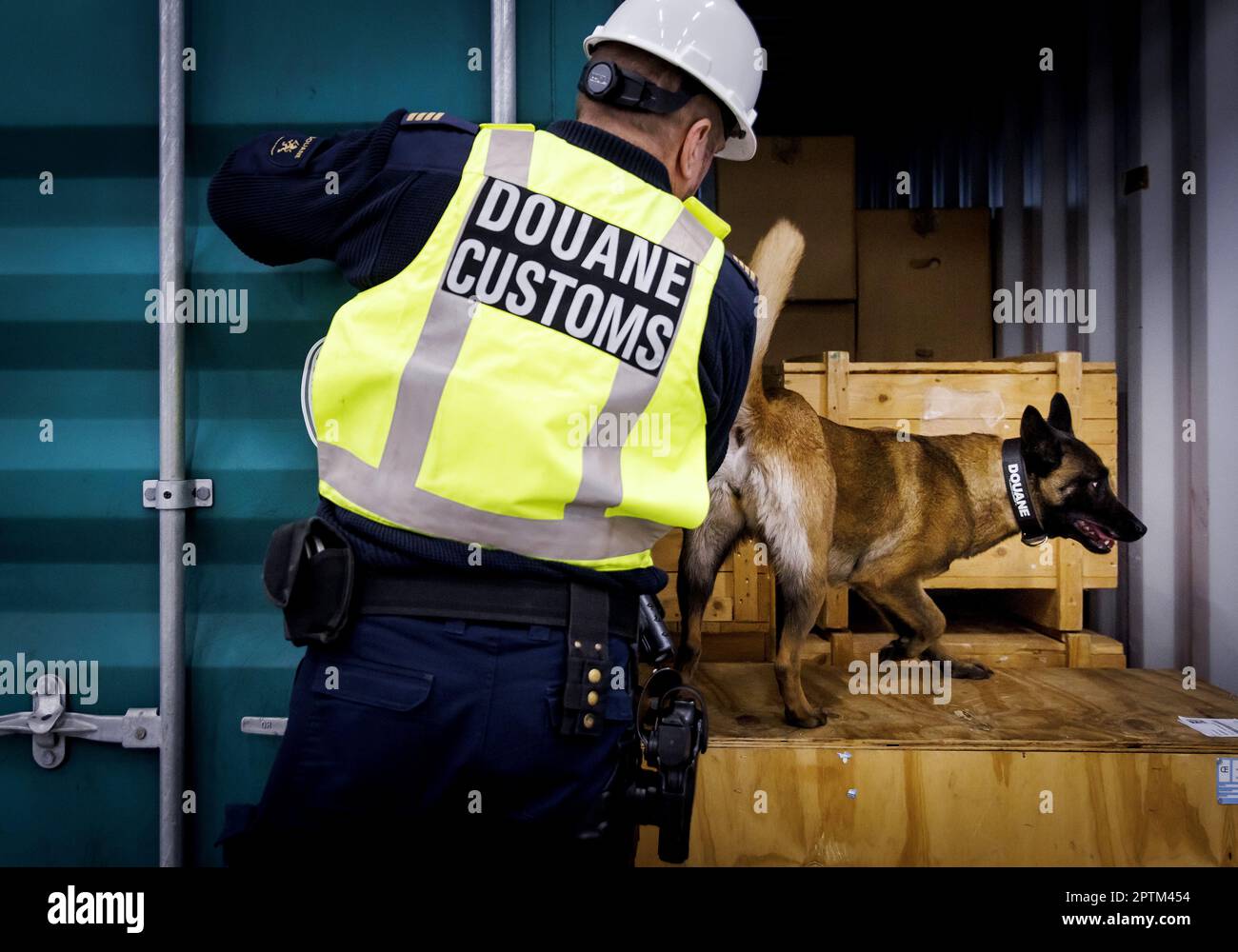 ROTTERDAM - A customs officer of the Port of Rotterdam Customs with a ...
