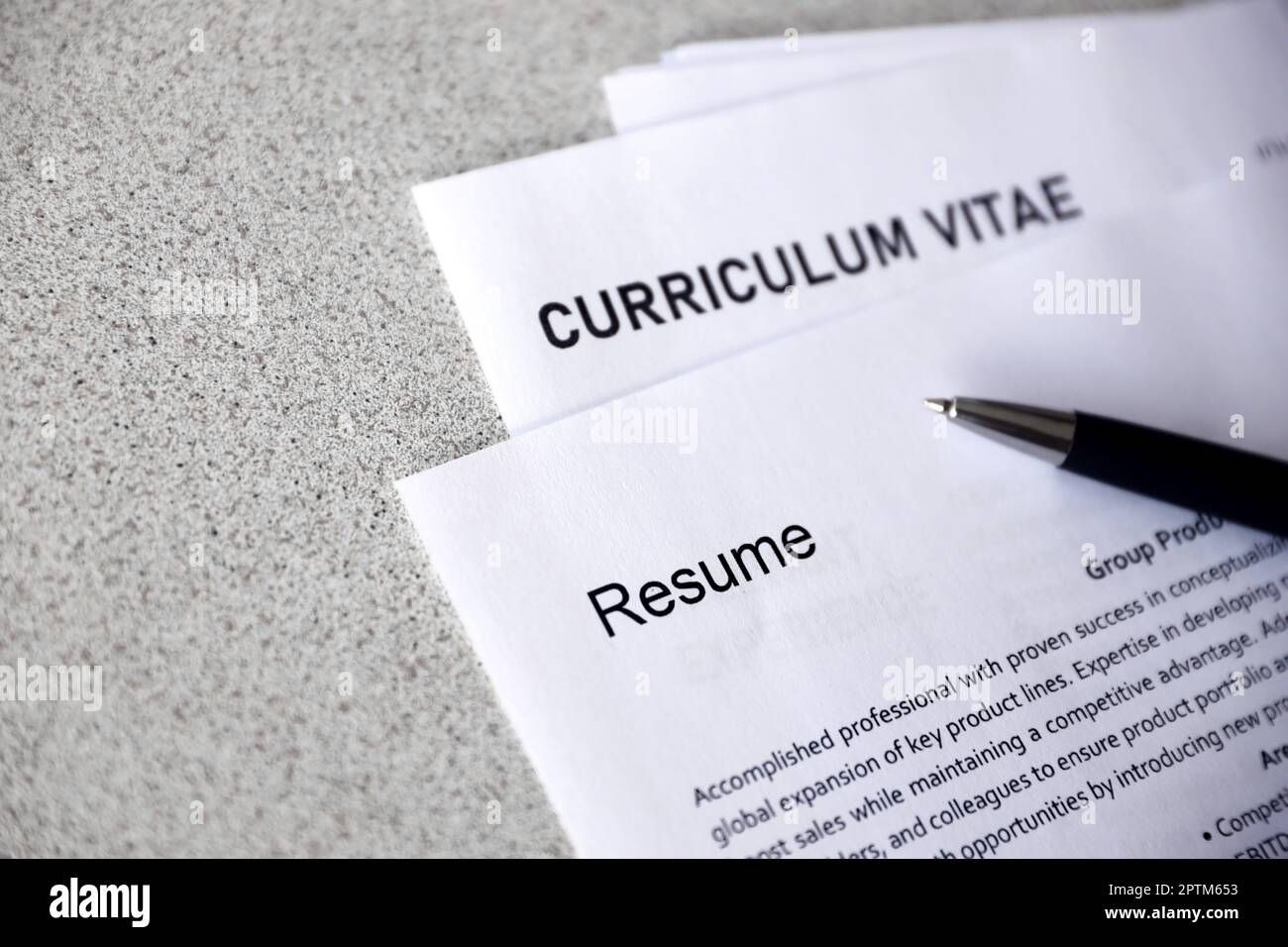 Top view of stack of office documents including resume and cv forms on ...