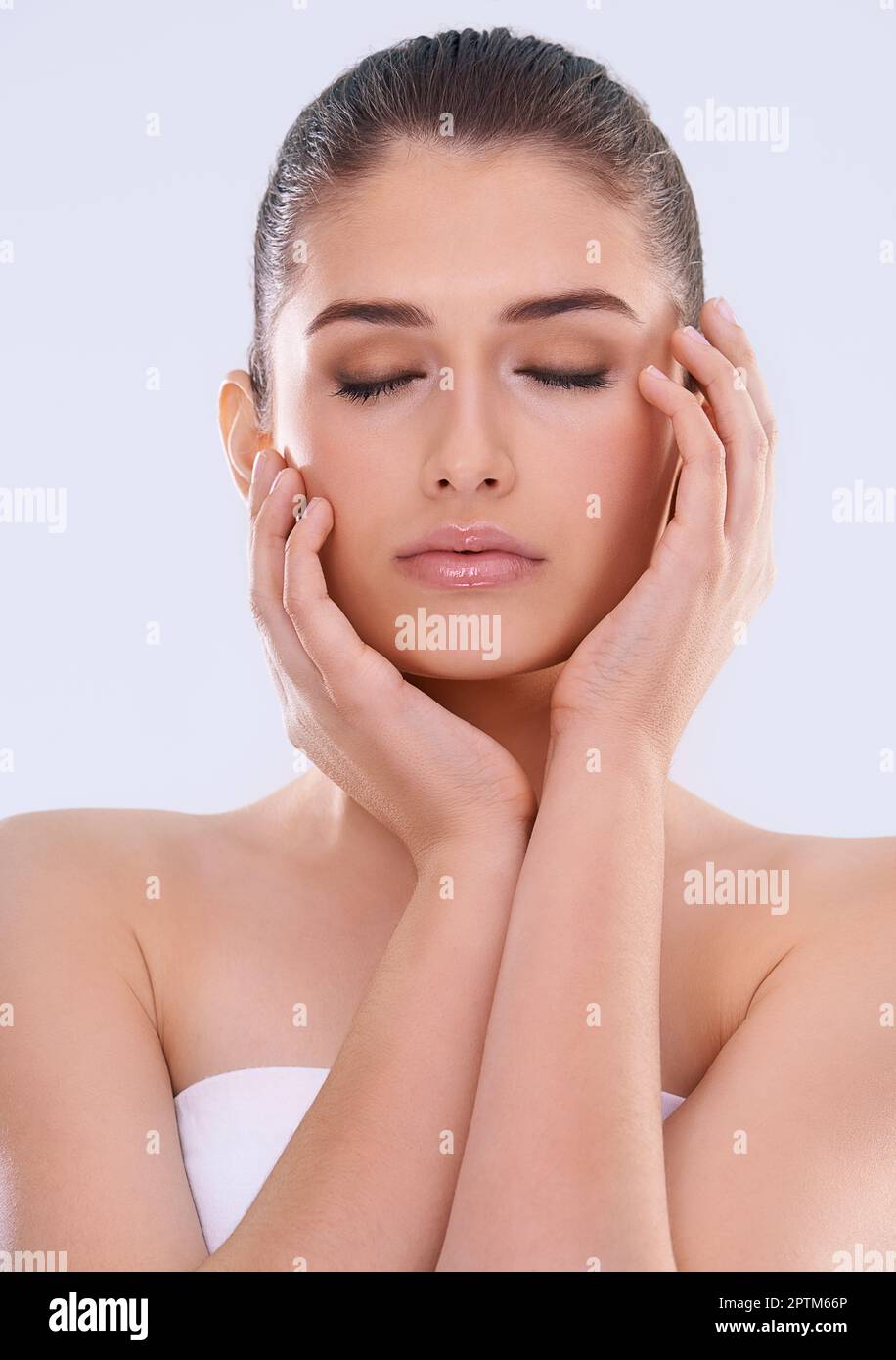 Beautifully smooth skin. Studio shot of a beautiful young woman ...