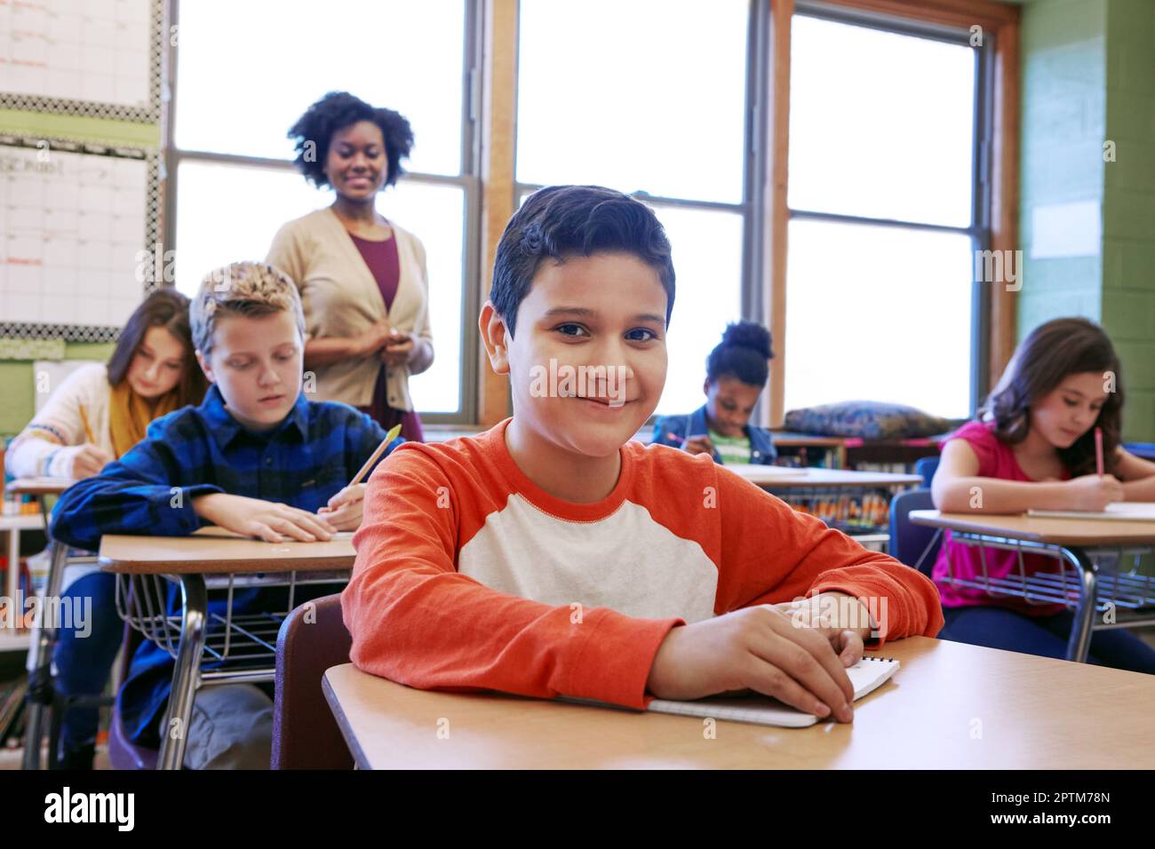 We learn for life not just for a test. a young boy sitting in class ...