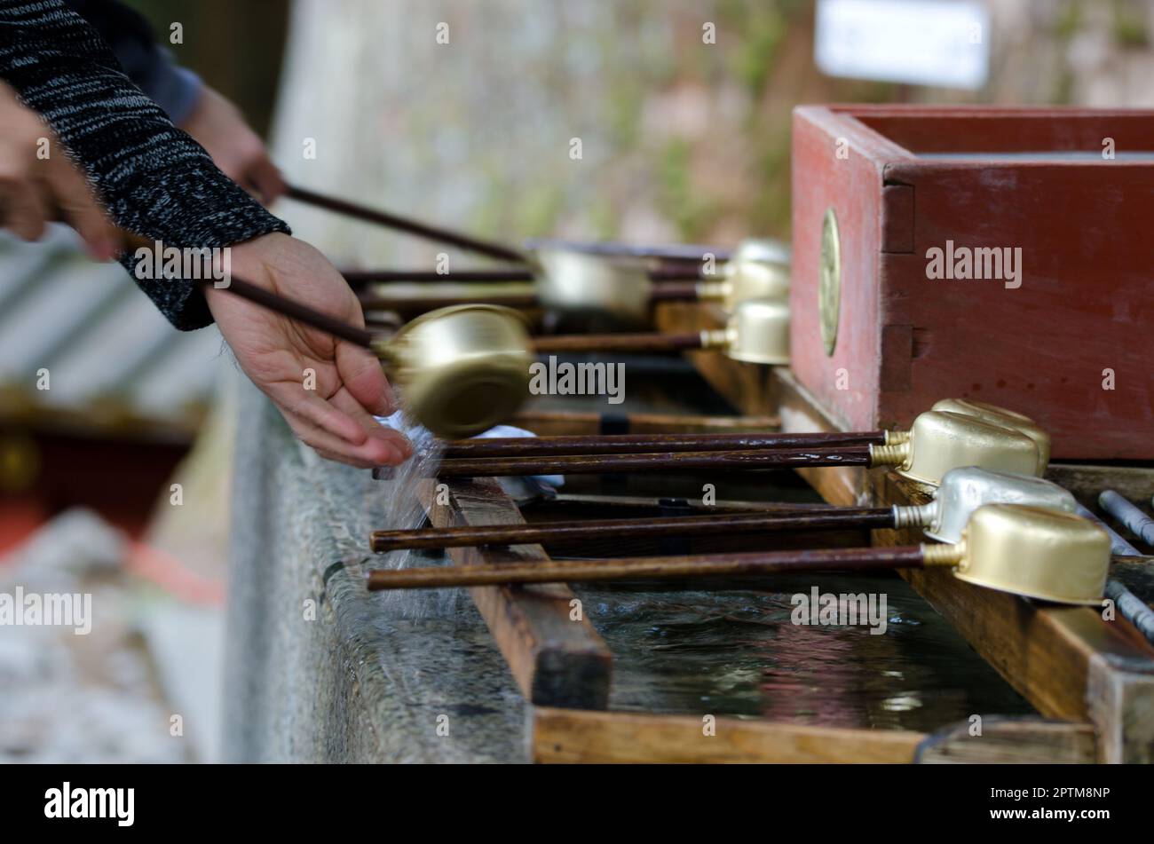 People performing ablutions, ceremonial purification rite known as ...