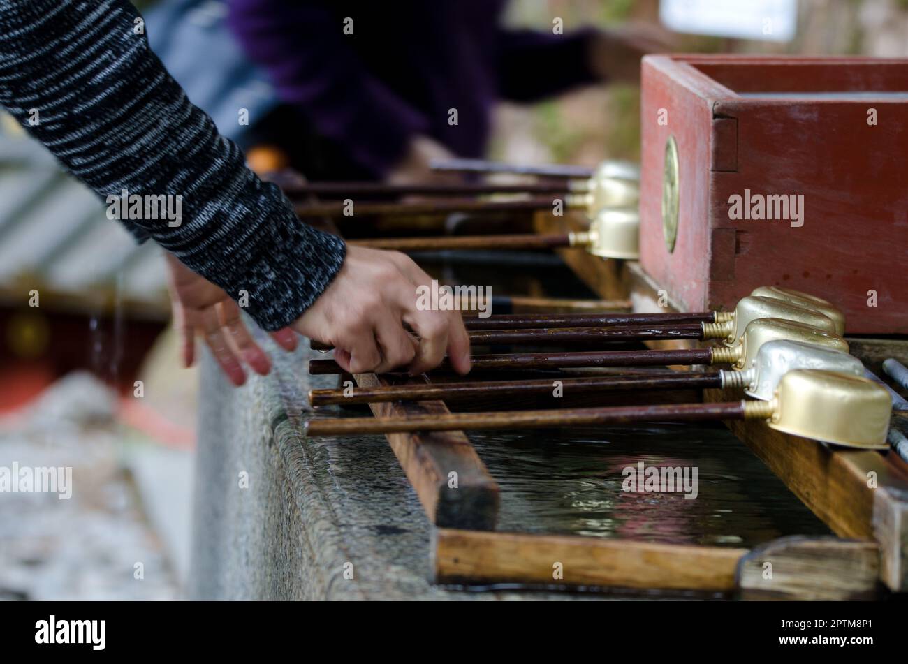 People performing ablutions, ceremonial purification rite known as ...