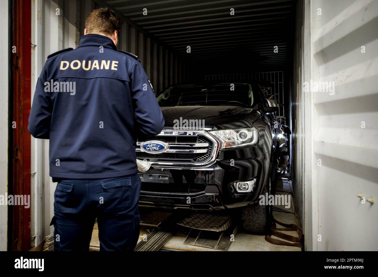 ROTTERDAM - Customs officers from Customs Rotterdam Port with a sniffer ...
