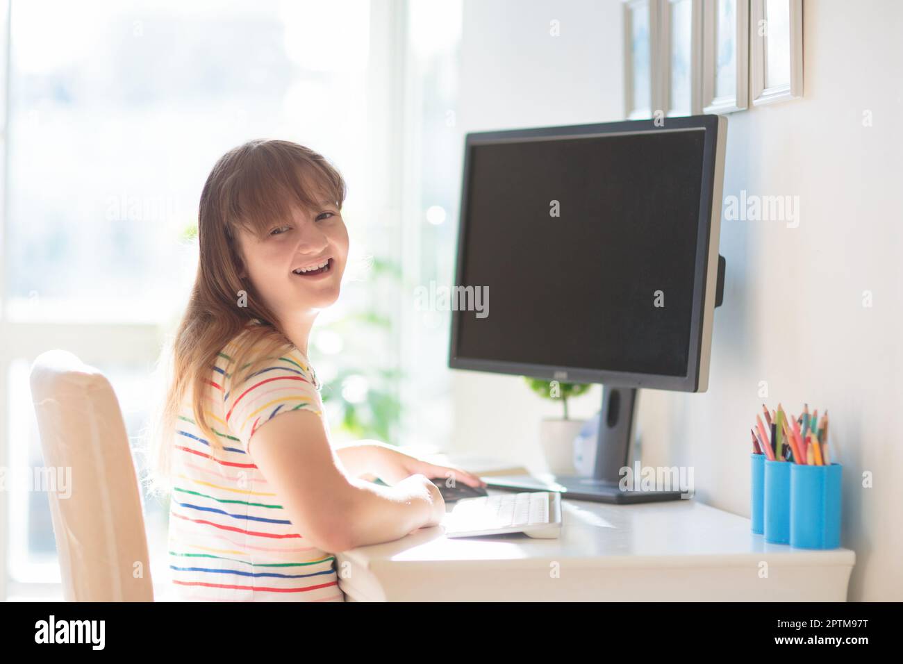 Child doing homework on computer. Online class. Homeschooling and ...