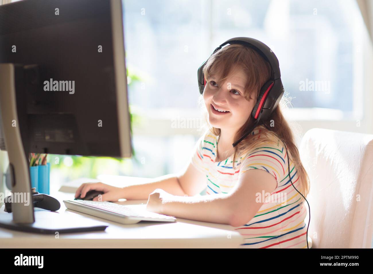 Child doing homework on computer. Online class. Homeschooling and ...