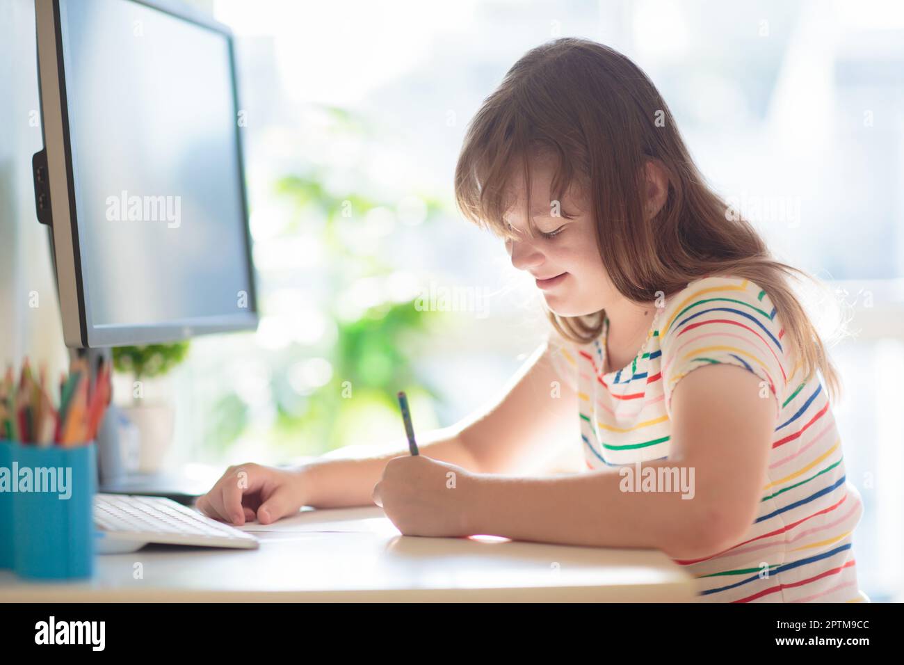Child doing homework on computer. Online class. Homeschooling and ...