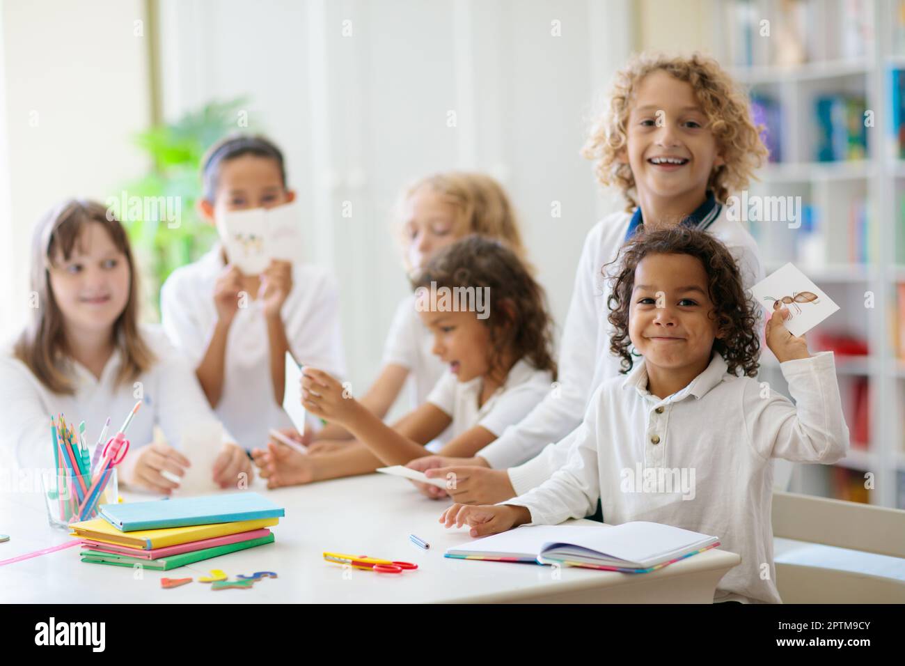 Kids go back to school. Interracial group of children of mixed age in ...