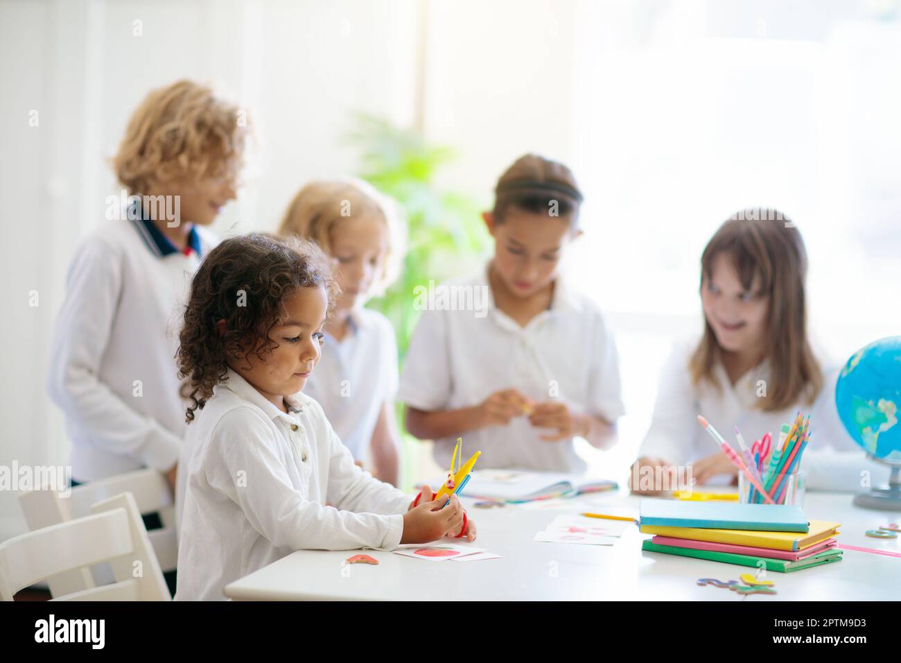 Kids go back to school. Interracial group of children of mixed age in ...