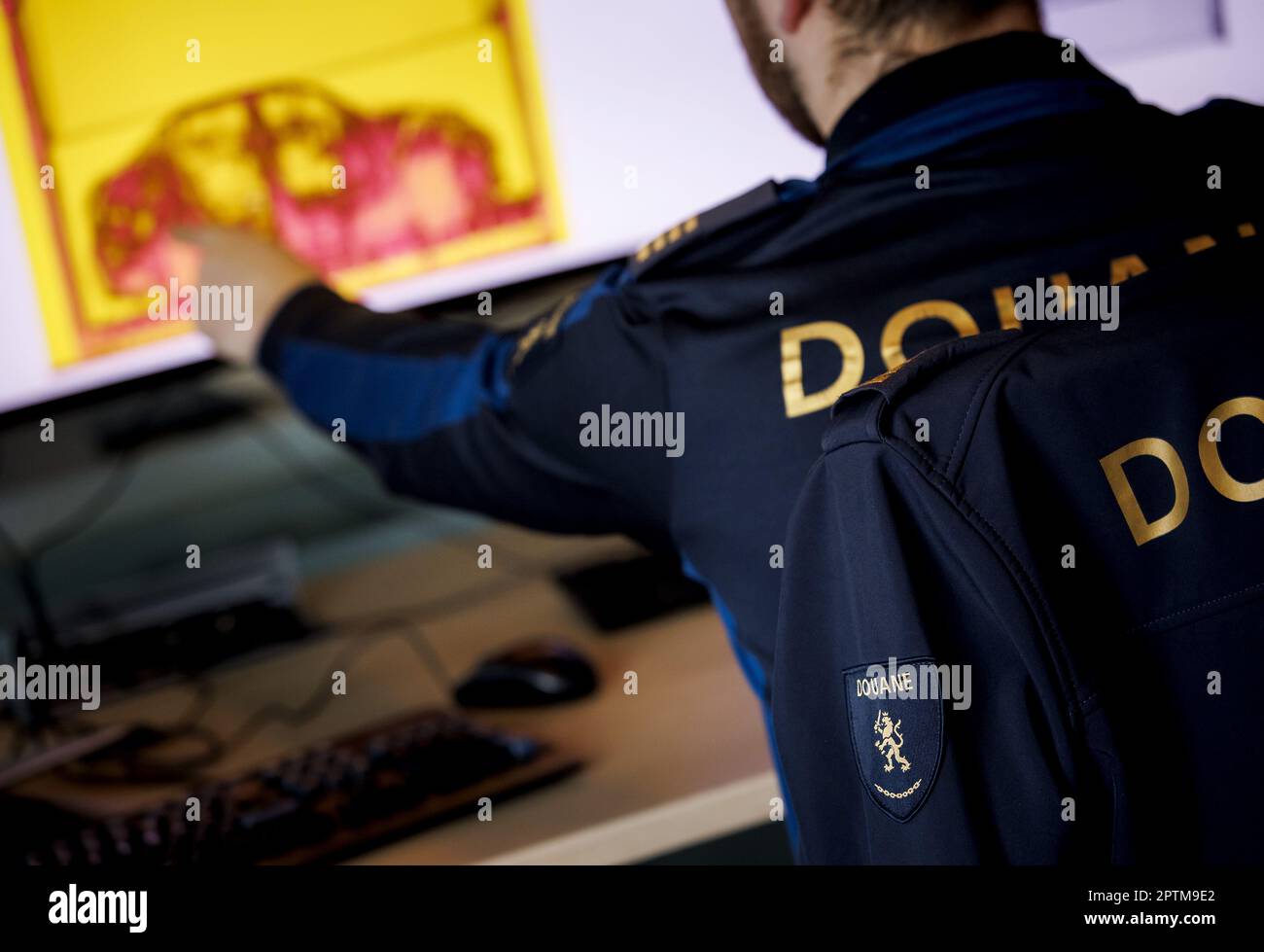 ROTTERDAM - A customs officer of the Port of Rotterdam Customs examines ...
