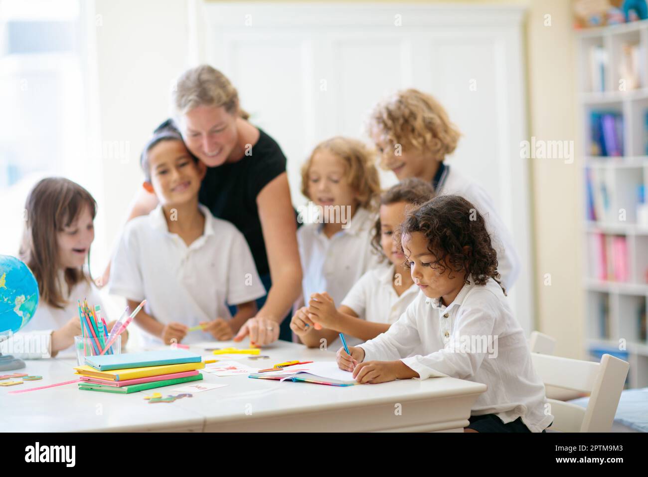 Kids go back to school. Interracial group of children of mixed age in ...