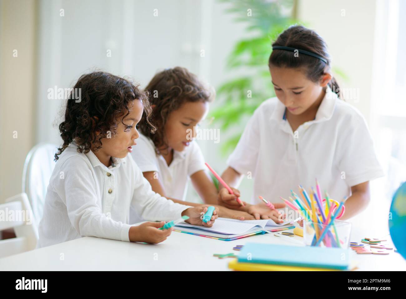 Kids go back to school. Interracial group of children of mixed age in ...