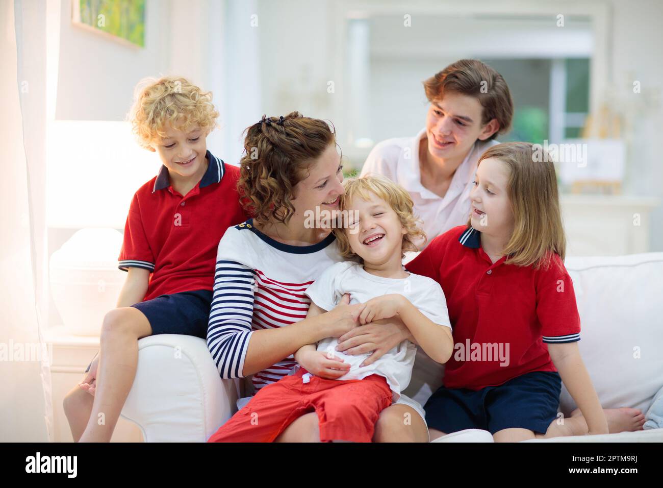 Mother and kids at home. Happy family with children. Mom and four ...