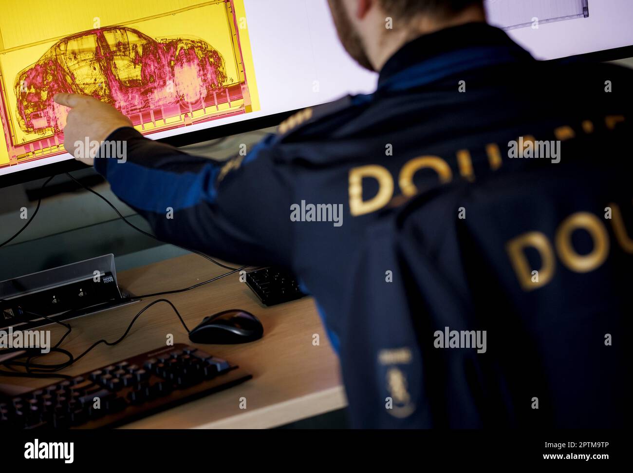 ROTTERDAM - A customs officer of the Port of Rotterdam Customs examines ...
