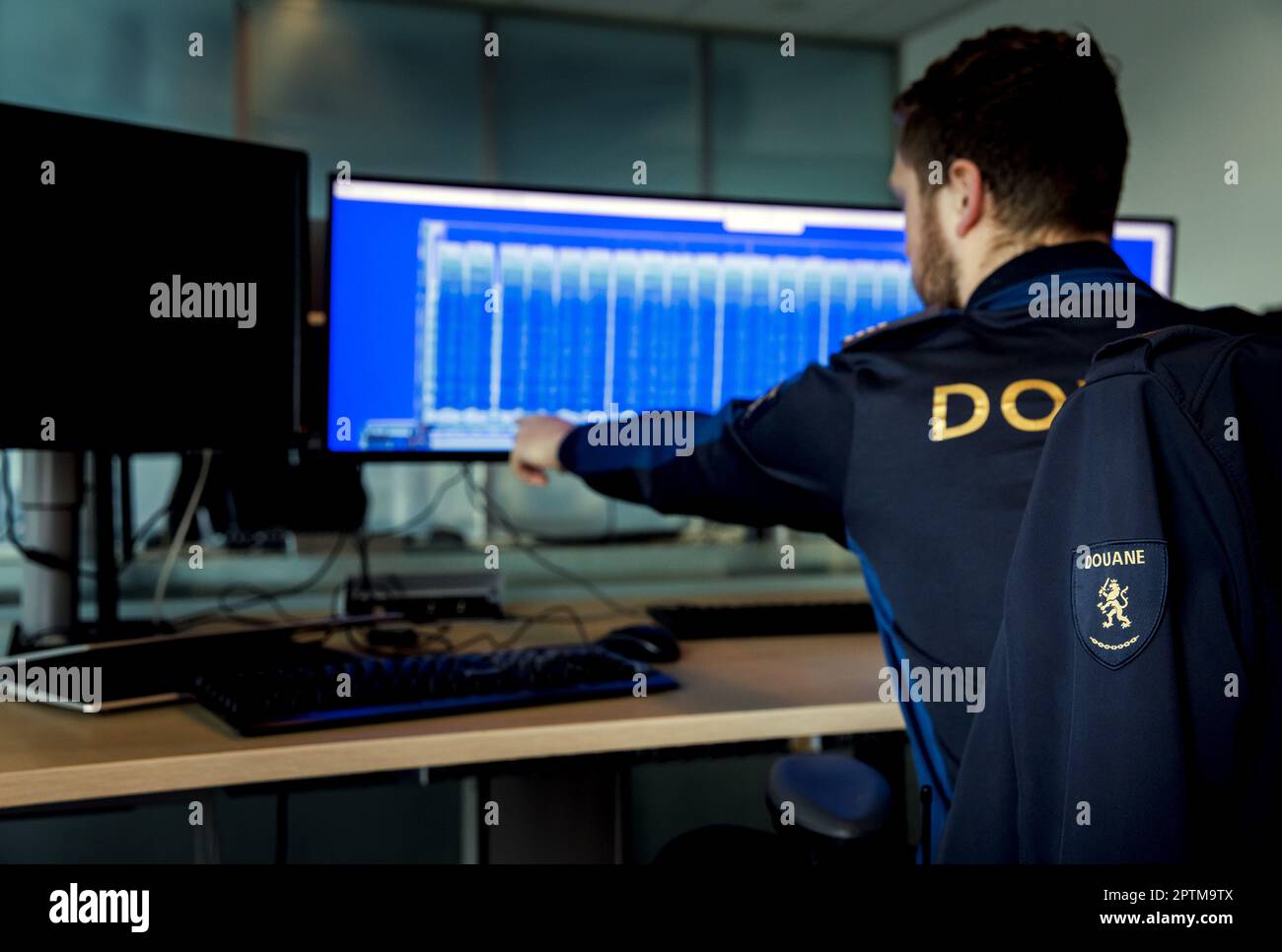 ROTTERDAM - A customs officer of the Port of Rotterdam Customs examines ...