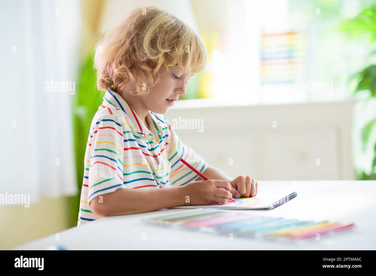 Child drawing. School kid painting a picture. Little boy with colorful ...