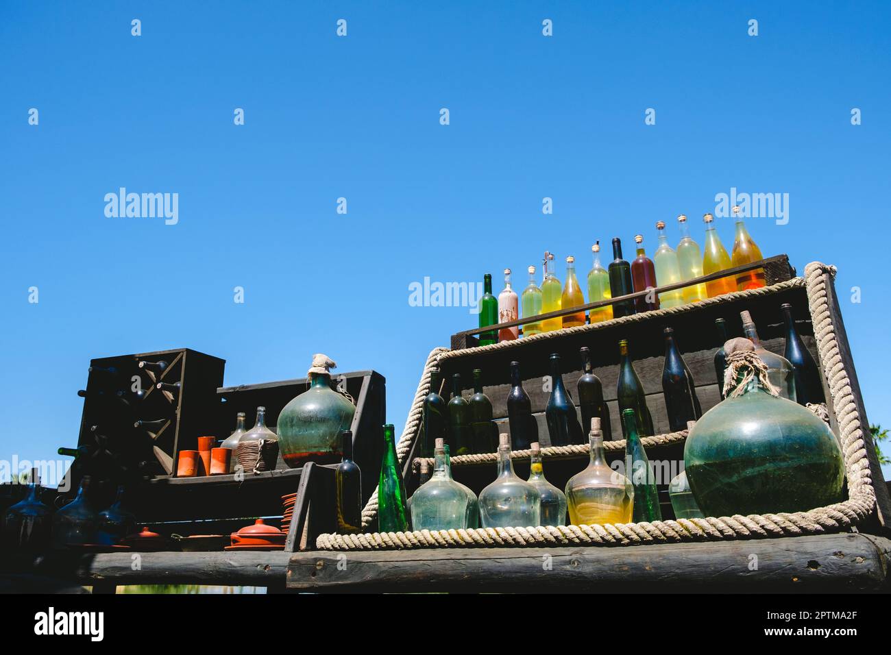 Old glass bottles in a display of a medieval market Stock Photo - Alamy