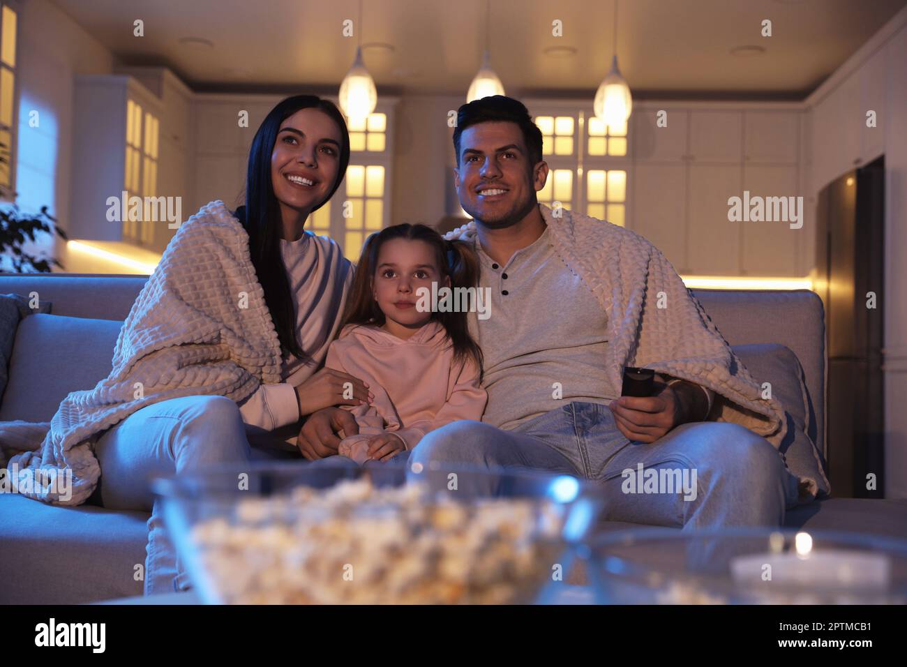 Family Watching Tv Together At Night