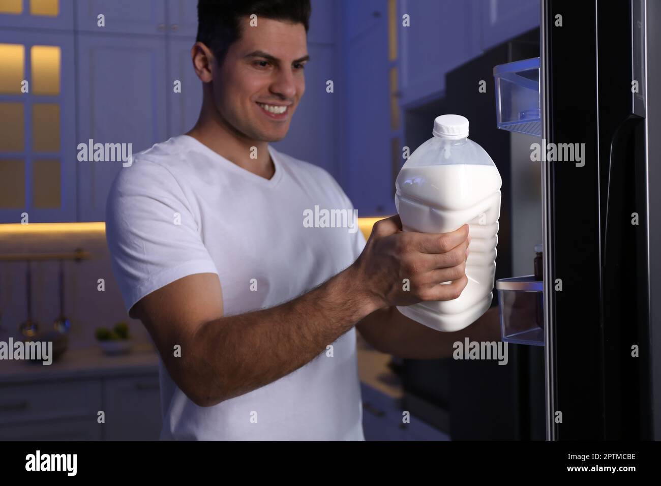 Man holding gallon bottle hi-res stock photography and images - Alamy
