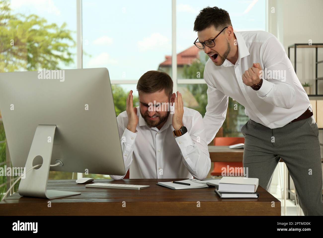 Boss screaming at employee in office. Toxic work environment Stock ...