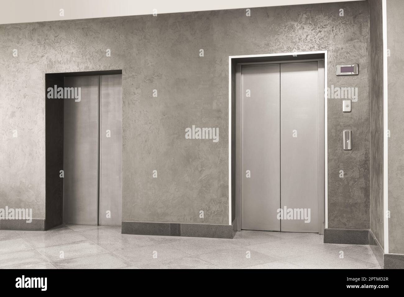 Closed stylish elevator doors in clean hall Stock Photo - Alamy
