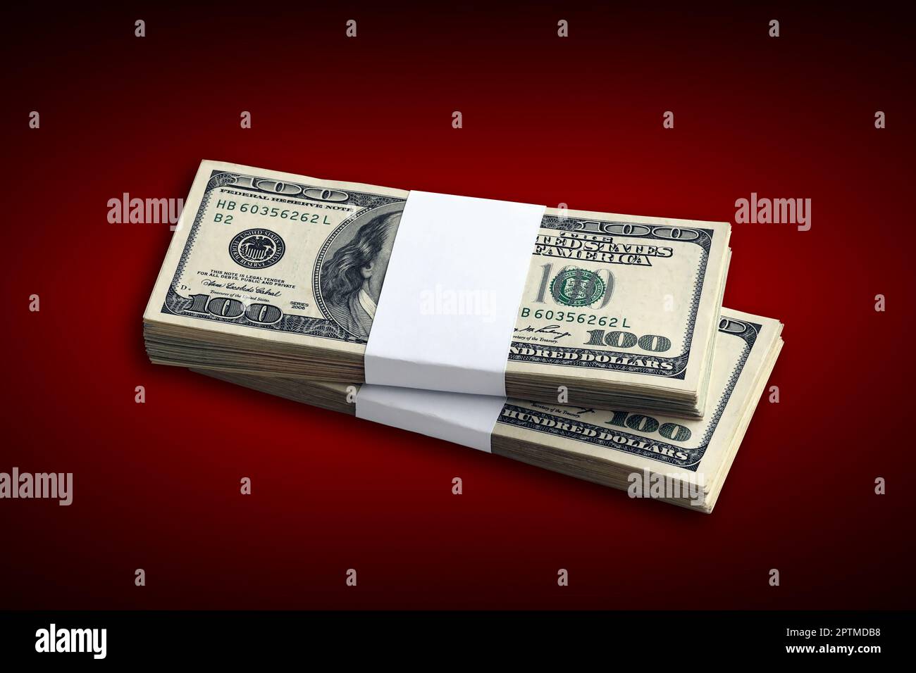 Bundle of US dollar bills on crimson red background. Pack of american ...
