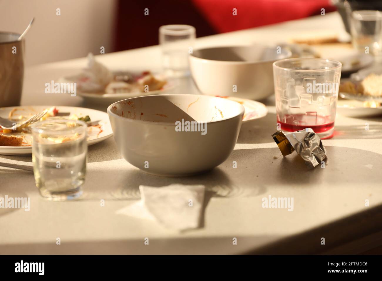 Empty dirty plates with spoons and forks on the table after meal ...