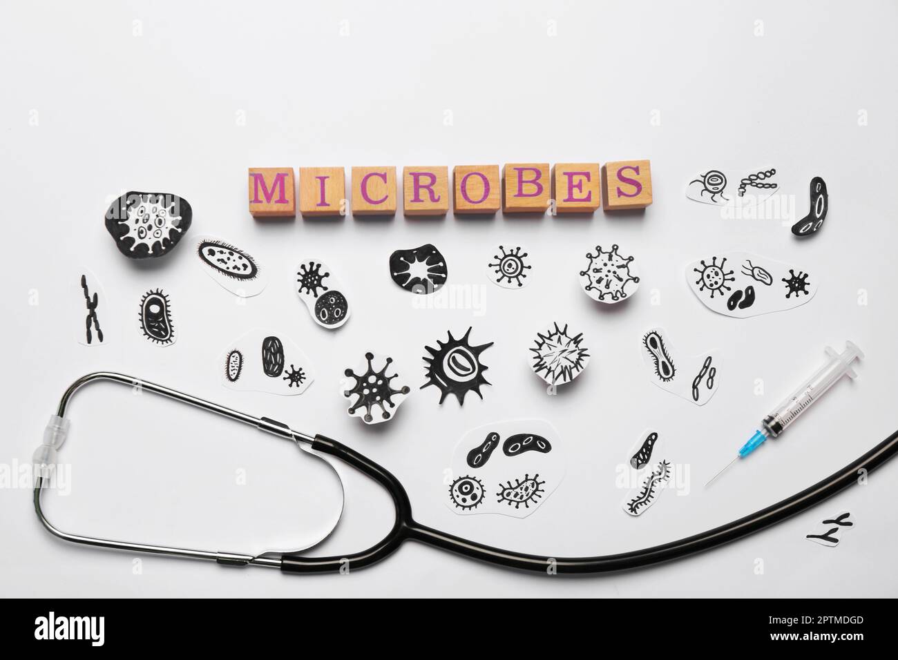 Word Microbes made with wooden cubes, pictures, syringe and stethoscope ...