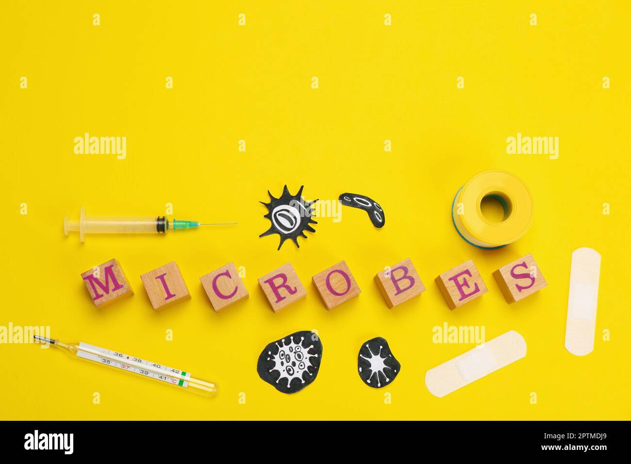 Word Microbes made with wooden cubes, pictures, syringe and thermometer ...
