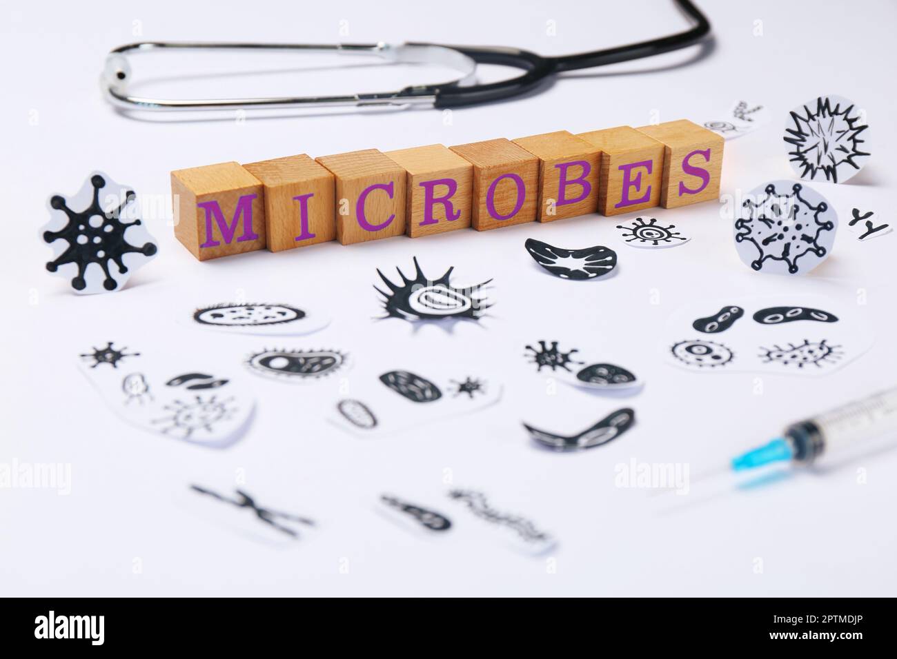 Word Microbes made with wooden cubes, pictures, syringe and stethoscope ...