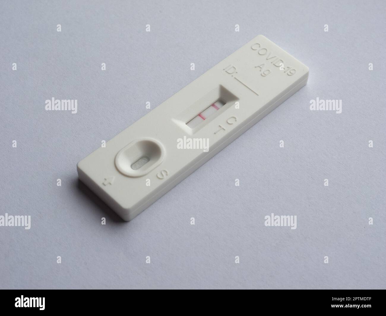 Positive Covid 19 antigen rapid test specimen well Stock Photo - Alamy