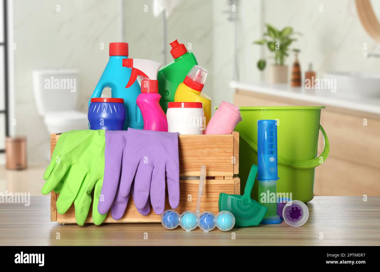 Different toilet cleaning supplies on wooden table in bathroom Stock ...
