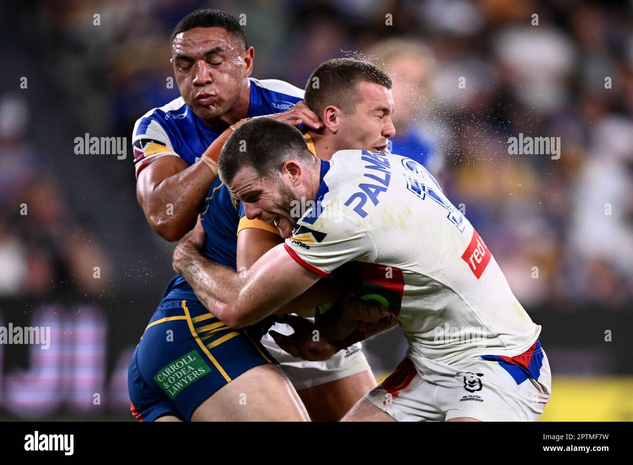 Brendan Hands of the Eels is tackled by Tyson Frizell (left) and ...