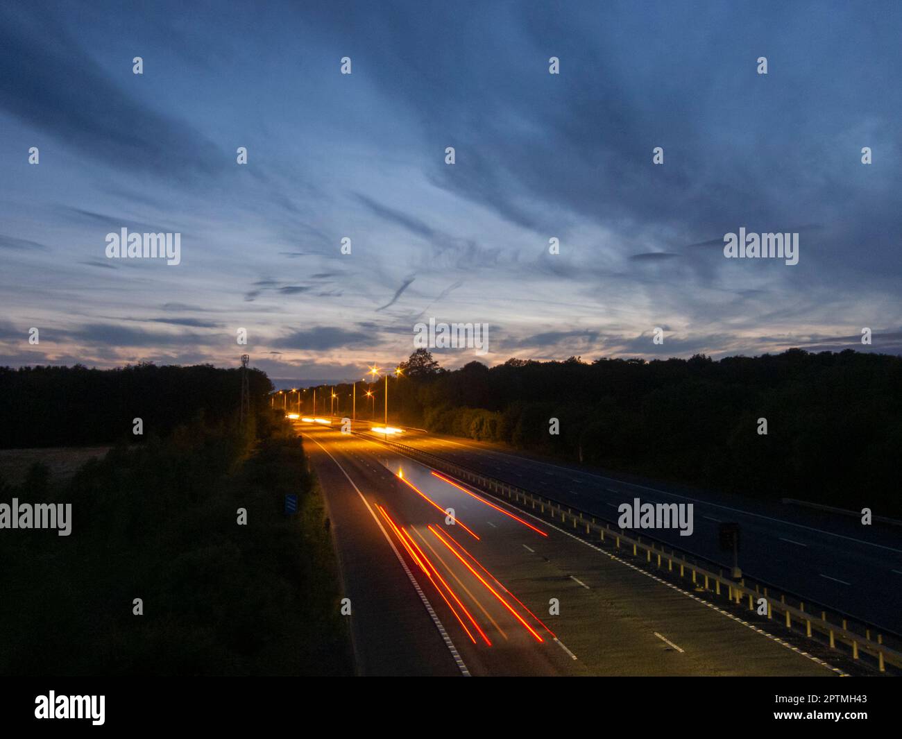 Light trails on the M20 motorway at dusk, Kent, UK Stock Photo - Alamy