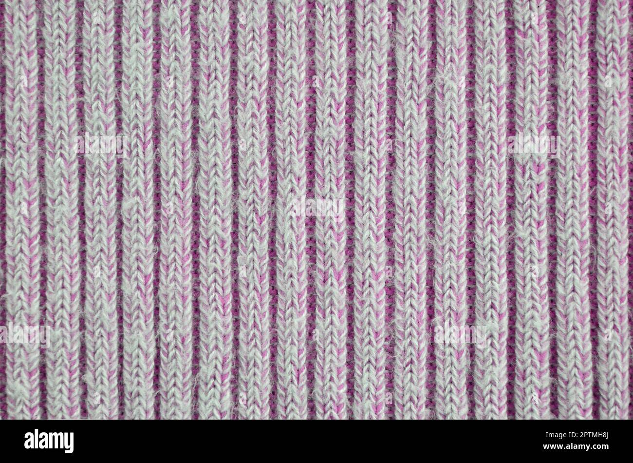 The texture of a knitted sweater wallpaper. Woolen fabric for wallpaper ...