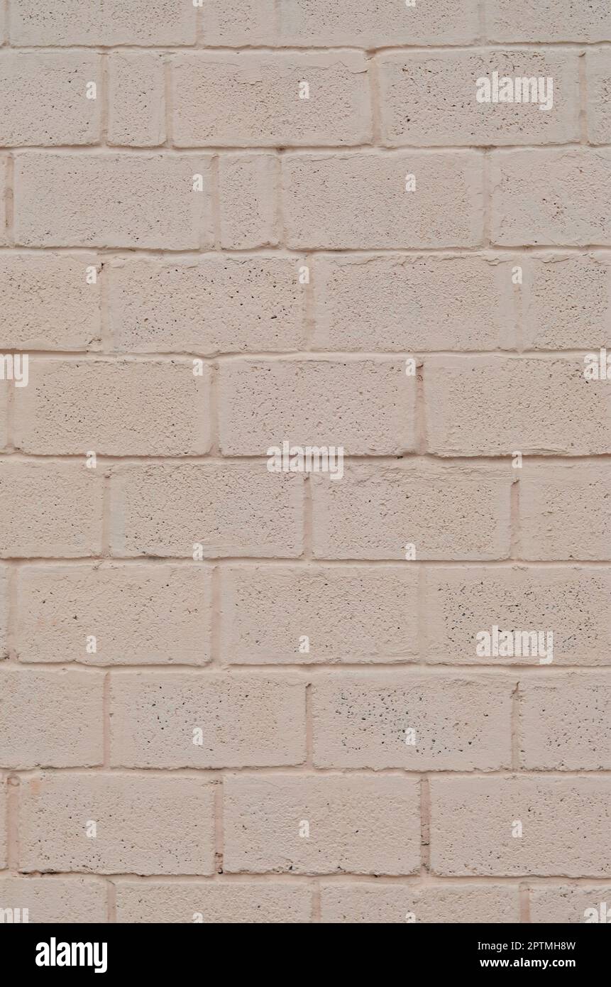 Weathered stained old colored beige block wall background. Texture of ...