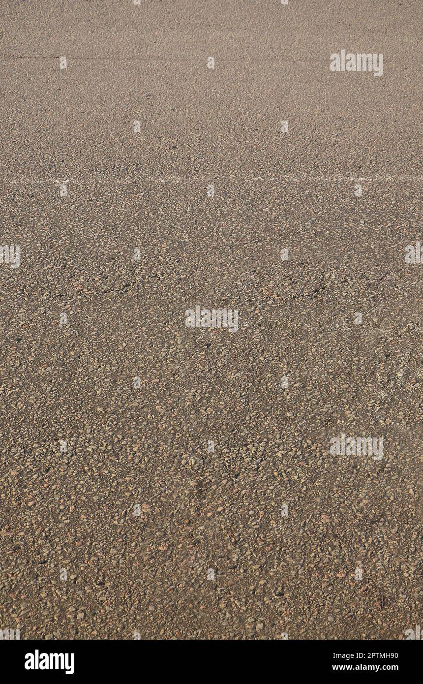 Texture of dirty and gloomy gray asphalt under sunlight during the ...