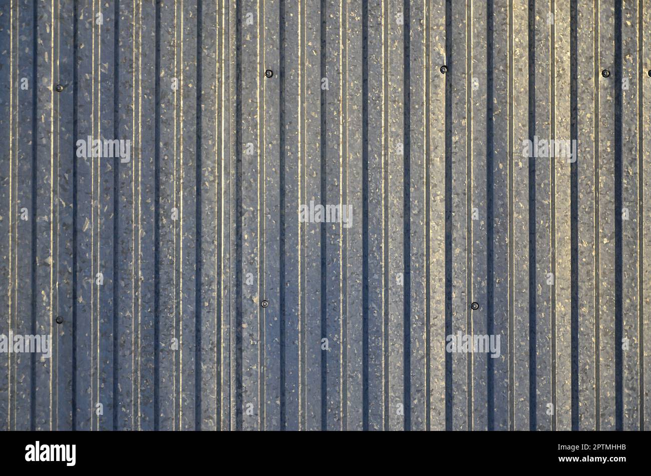 Siding, metal panels texture closeup in the daytime outdoors. Metal ...