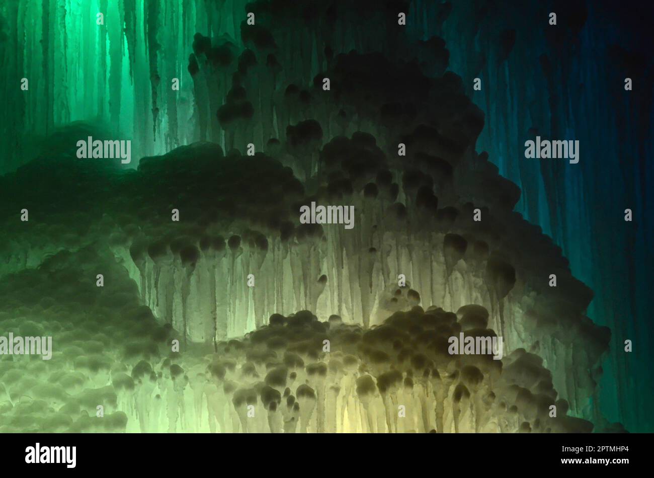 Huge ice icicles. Fragment of large blocks of ice frozen waterfall of ...