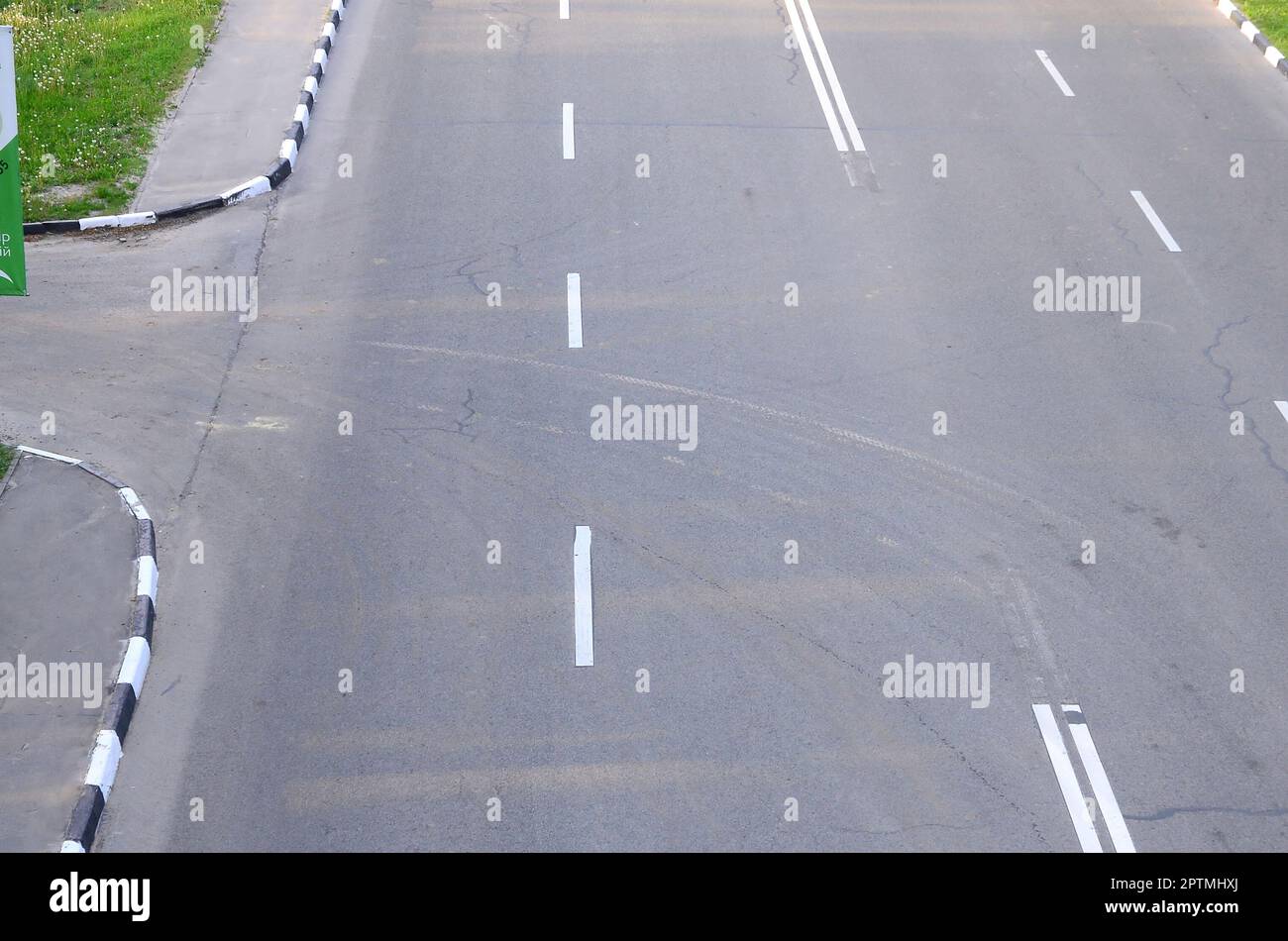 Damaged bad asphalt road with potholes. Patch repair of asphalt. Bad ...