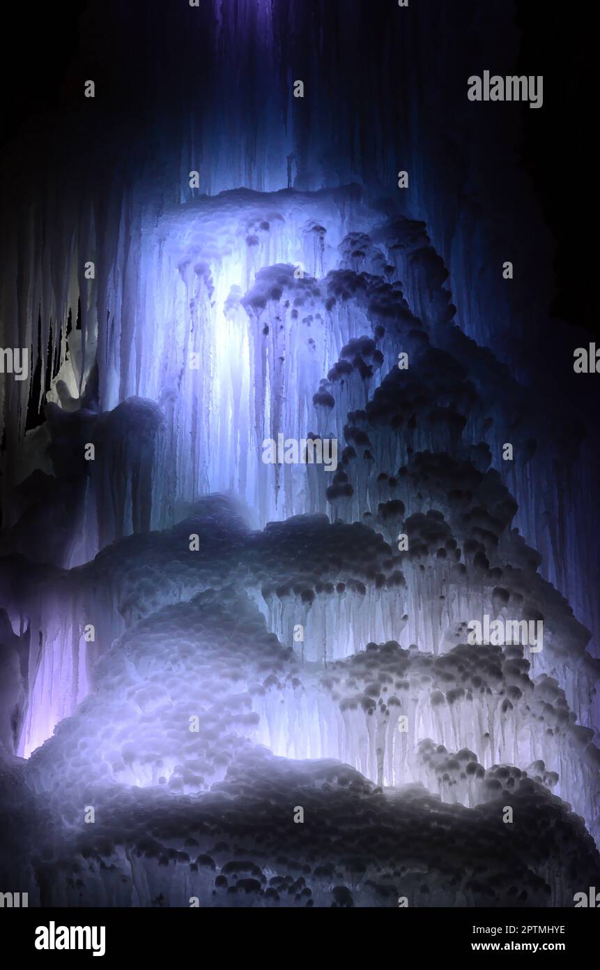 Huge ice icicles. Fragment of large blocks of ice frozen waterfall of ...
