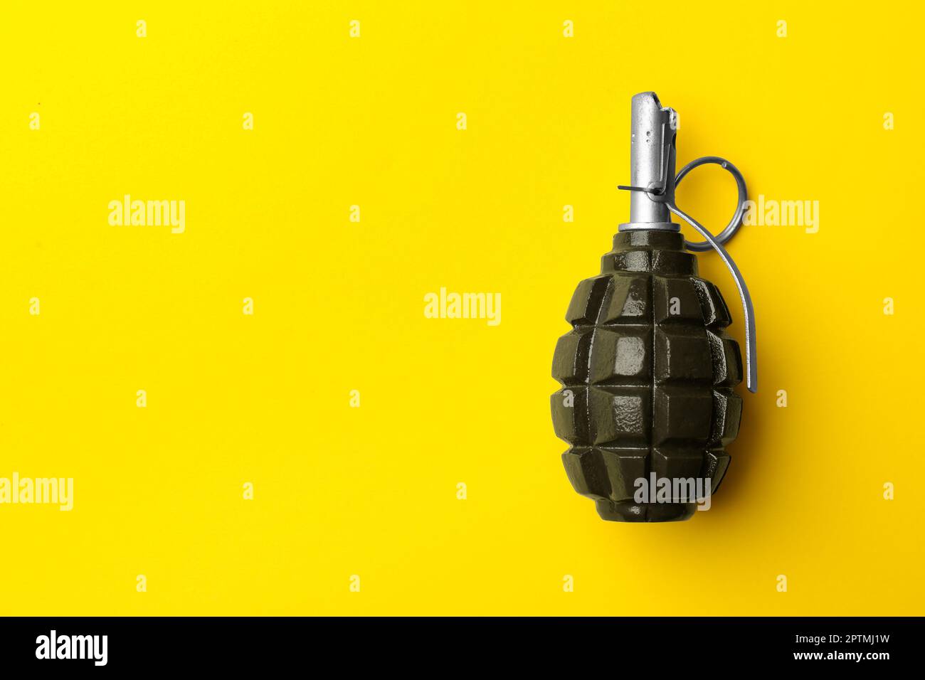 Hand grenade on yellow background, top view. Space for text Stock Photo ...