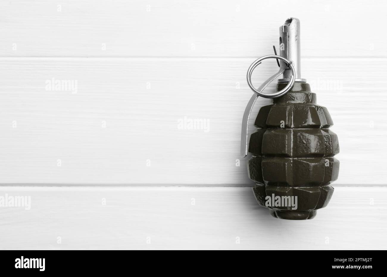 Hand grenade on white wooden table, top view. Space for text Stock ...