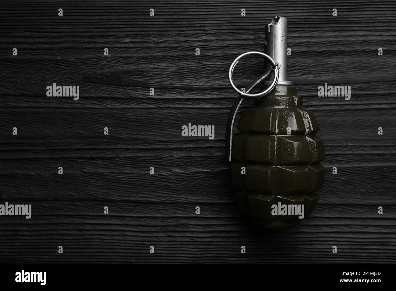 Hand grenade on black wooden table, top view. Space for text Stock ...