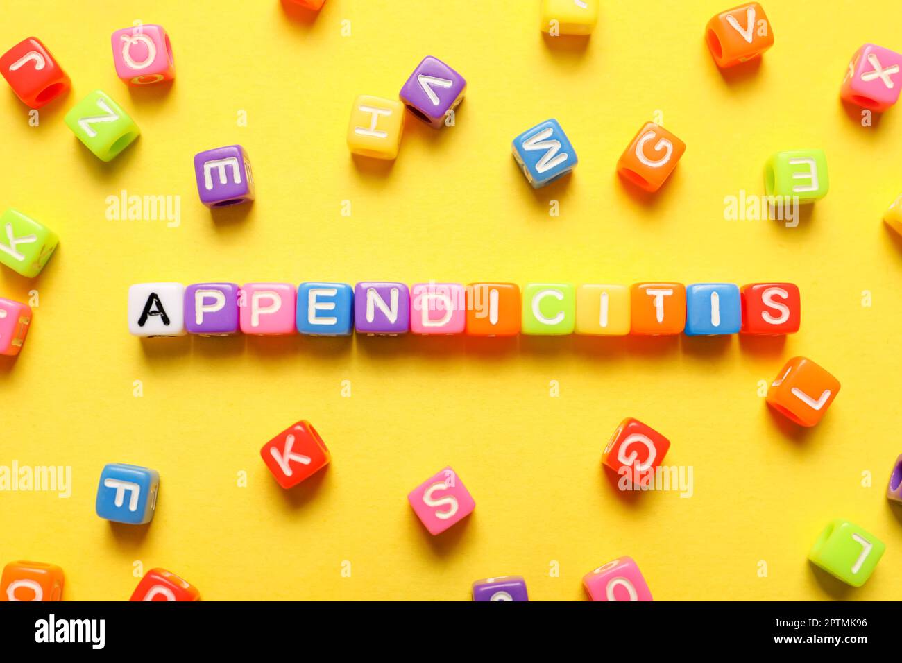 Word Appendicitis made of color cubes with letters on yellow background ...