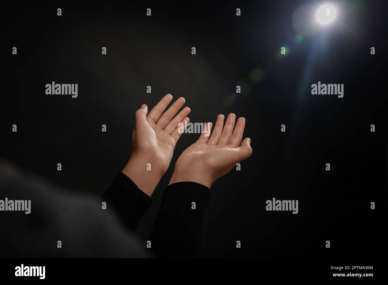 Christian woman stretching hands hi-res stock photography and images ...
