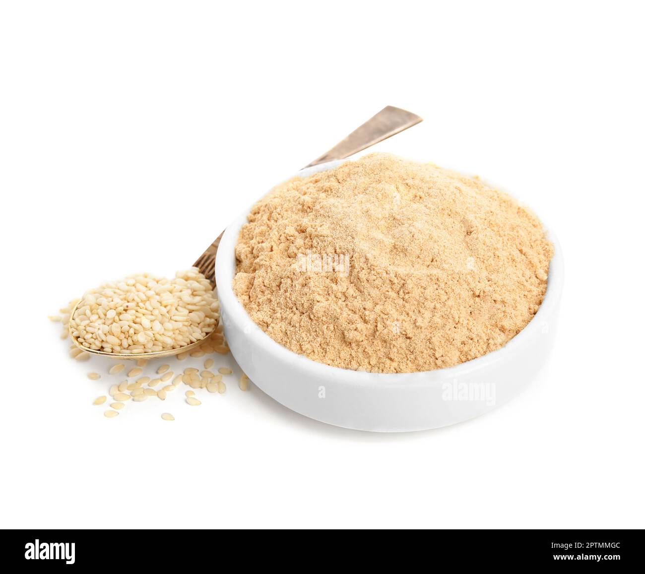 Sesame flour in ceramic bowl and spoon of seeds isolated on white Stock ...
