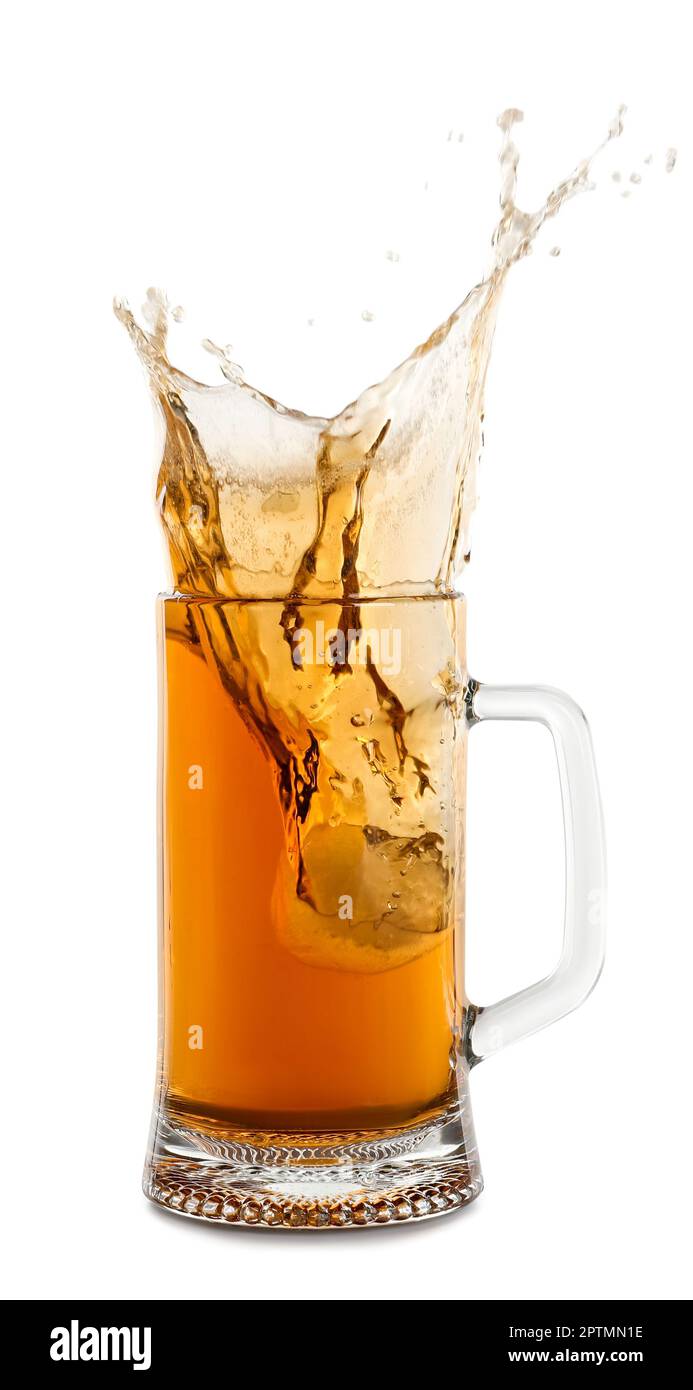 Beer splashing out of glass on white background Stock Photo - Alamy