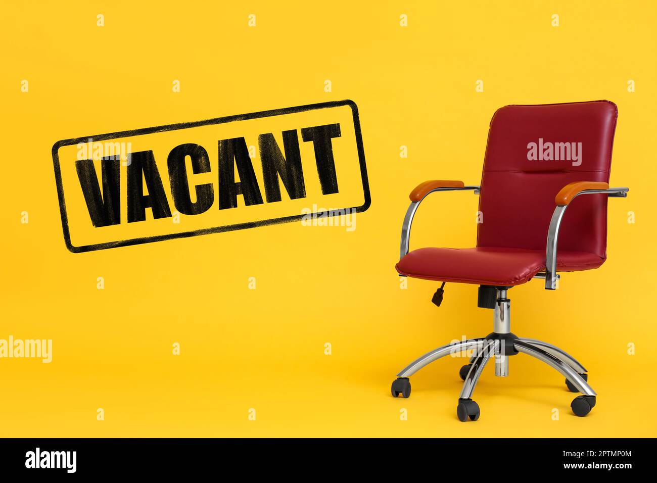 Red office chair and word VACANT on yellow background Stock Photo - Alamy