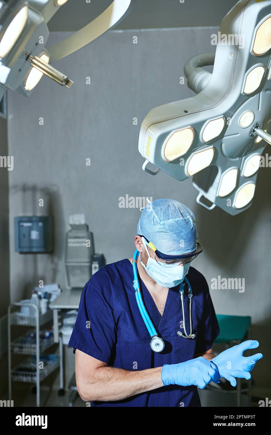 Saving lives is a full time job. a surgeon in an operating room Stock ...