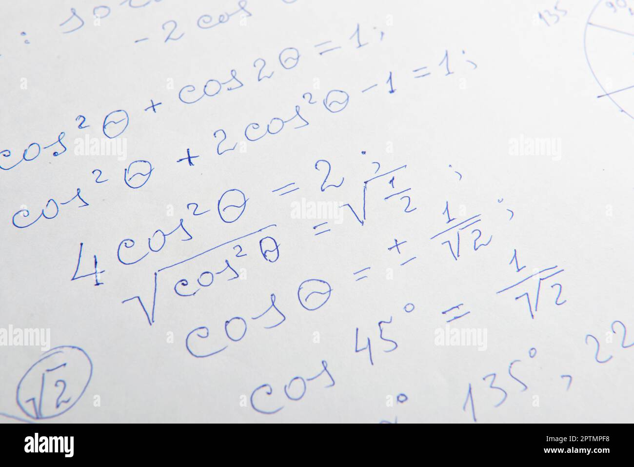 Paper with written mathematical calculations as background, closeup ...